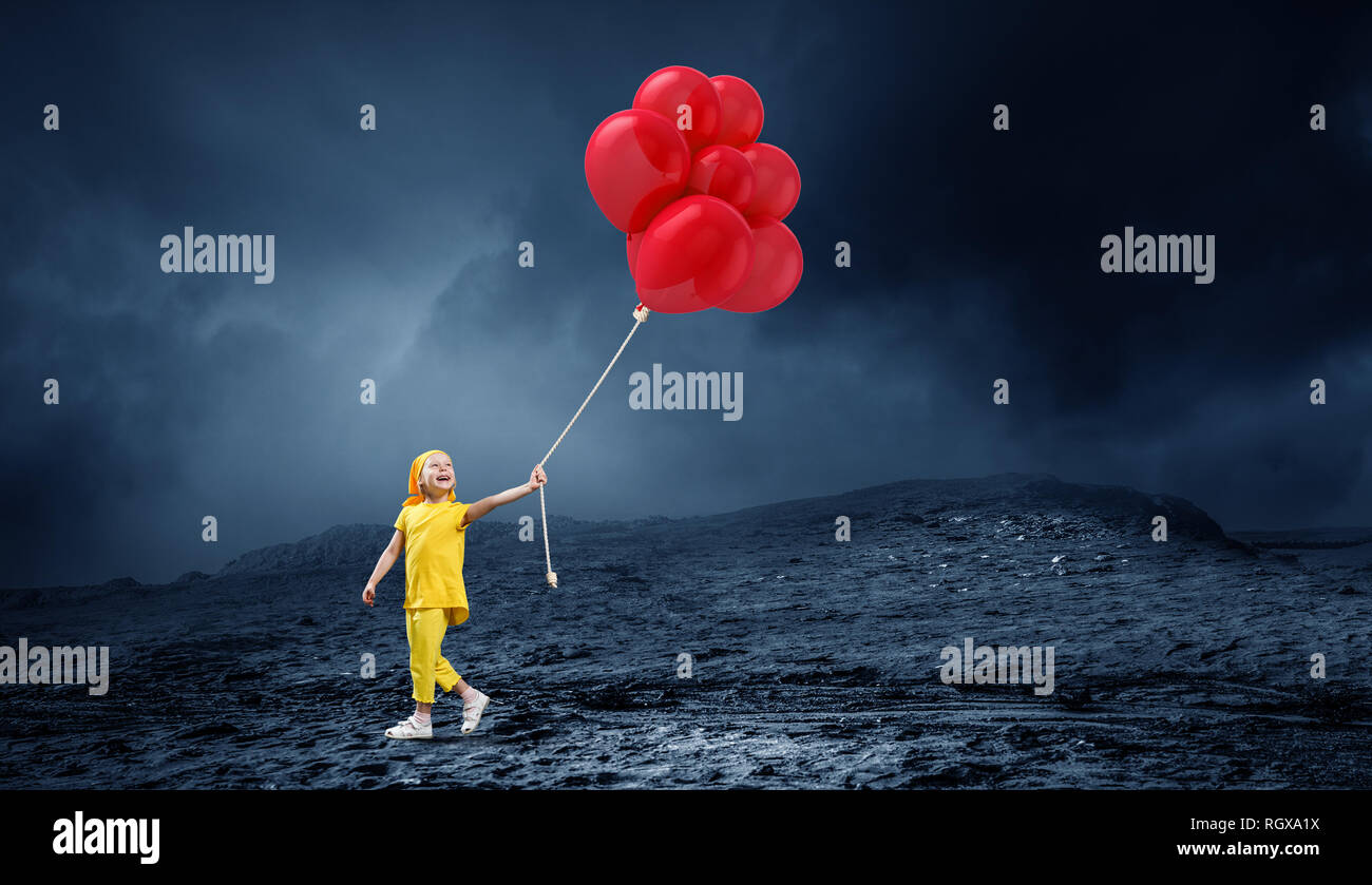 Little kid girl with balloons walking alone. Mixed media Stock Photo ...
