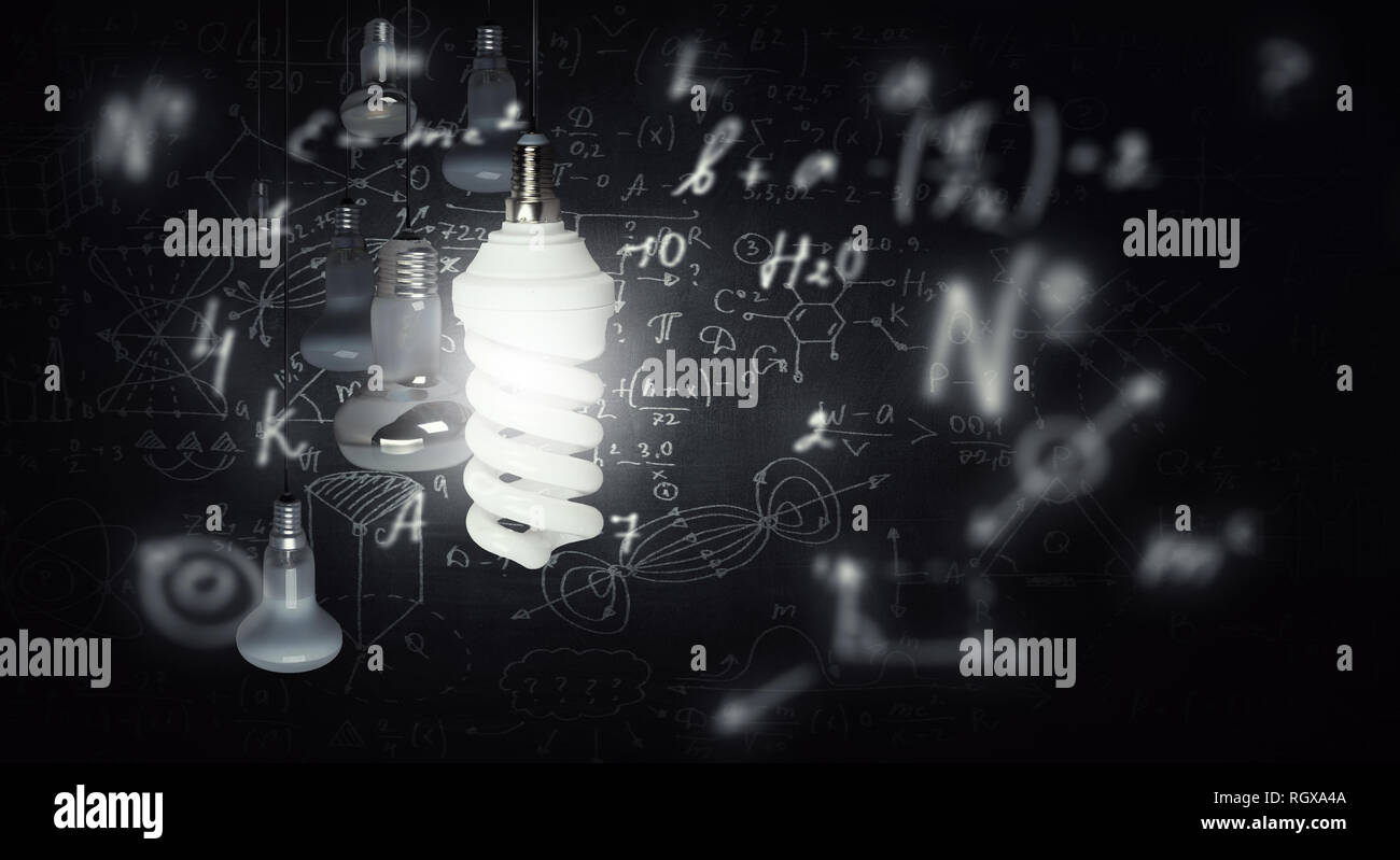 Glowing glass light bulb hanging from above and business sketches at ...