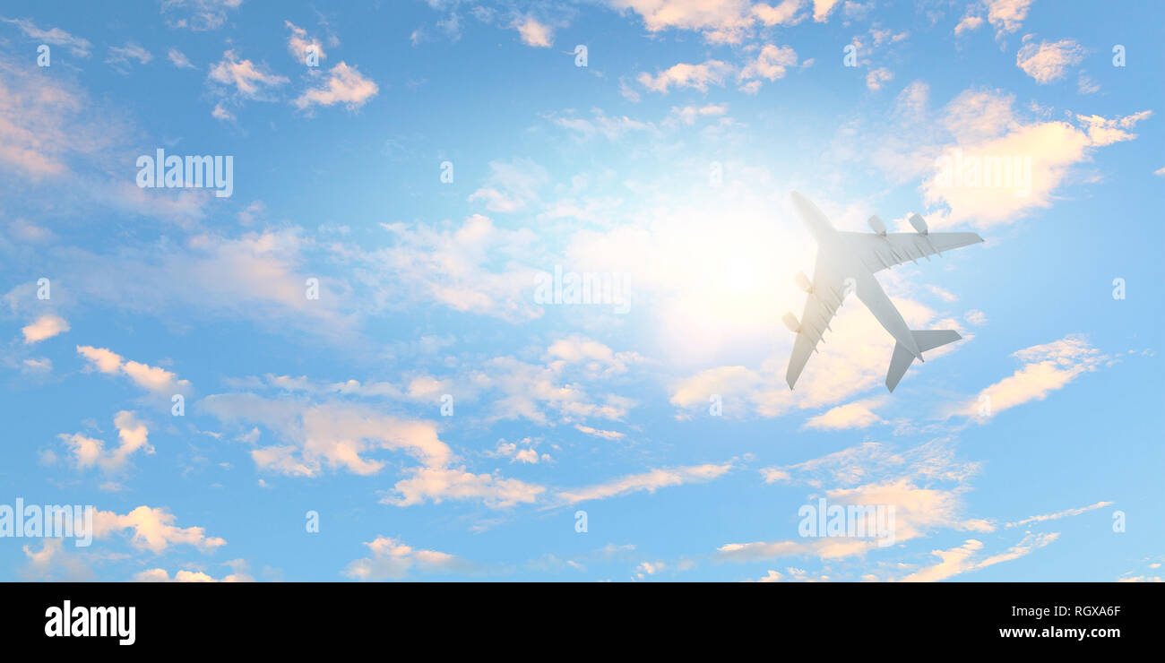 Bottom angle view of airplane in sky over city buildings Stock Photo ...