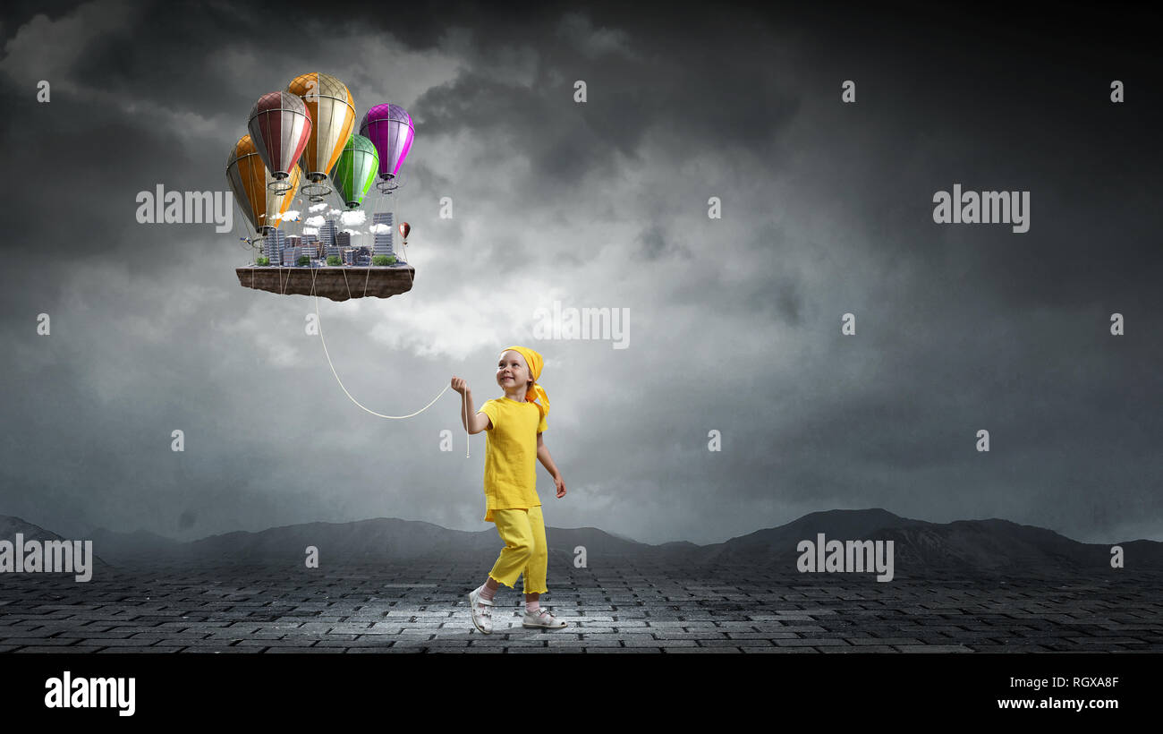 Little kid girl with balloons walking alone. Mixed media Stock Photo ...