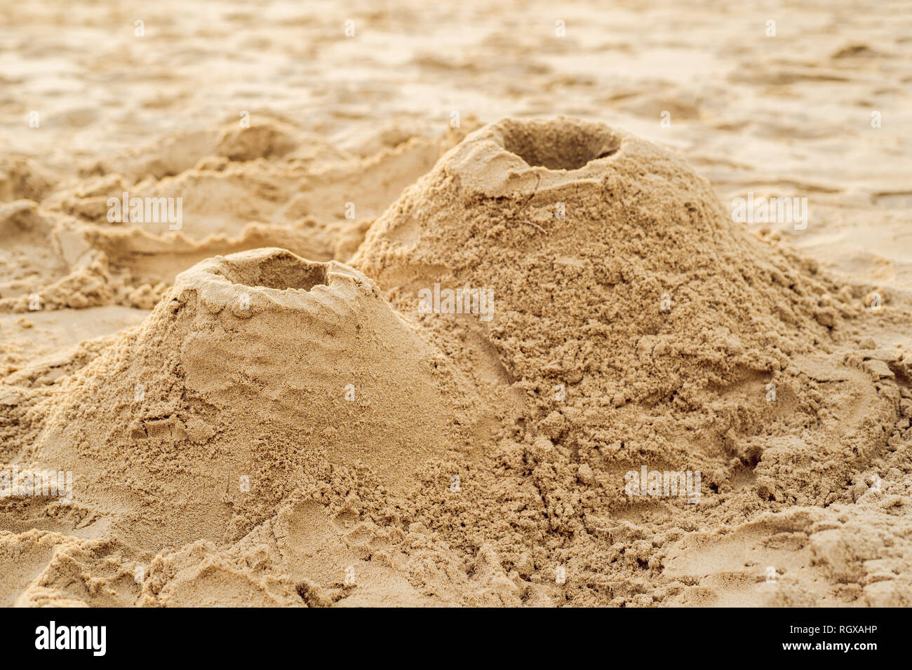 A volcano made of sand on the beach Stock Photo - Alamy