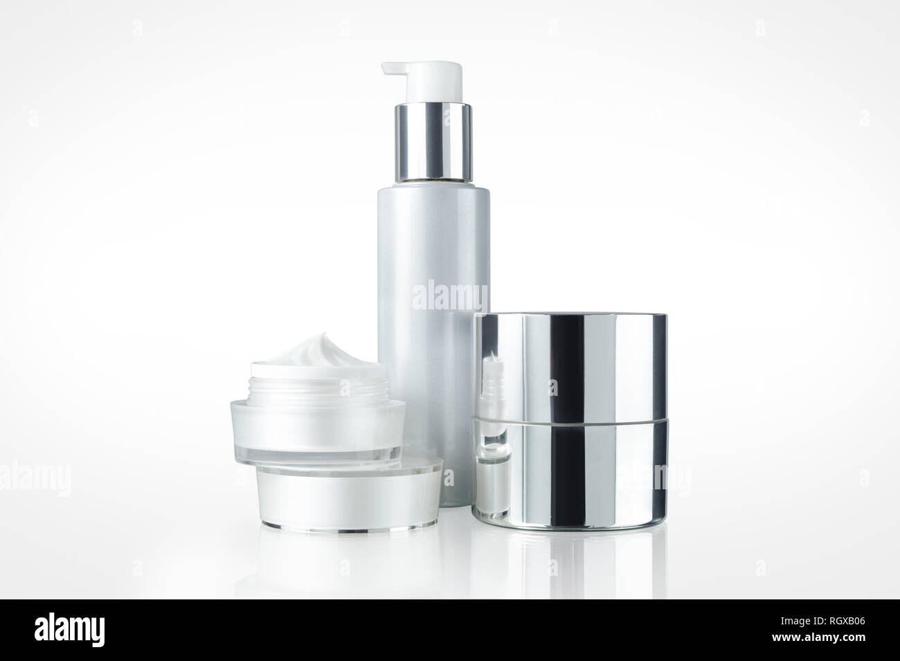 Set of cosmetic containers. Cosmetic product dispenser bottle and jars ...