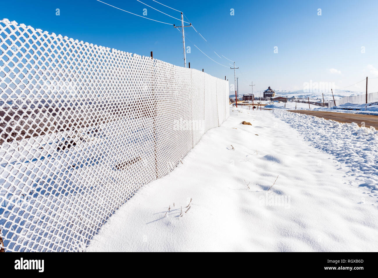 Snow mesh fence, winter patterns Stock Photo - Alamy