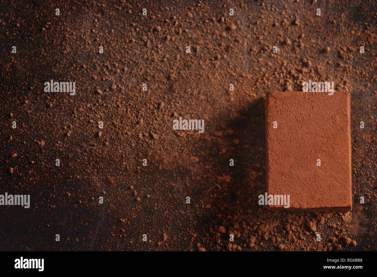 Cocoa powder texture close-up. Soft chocolates on a black background ...