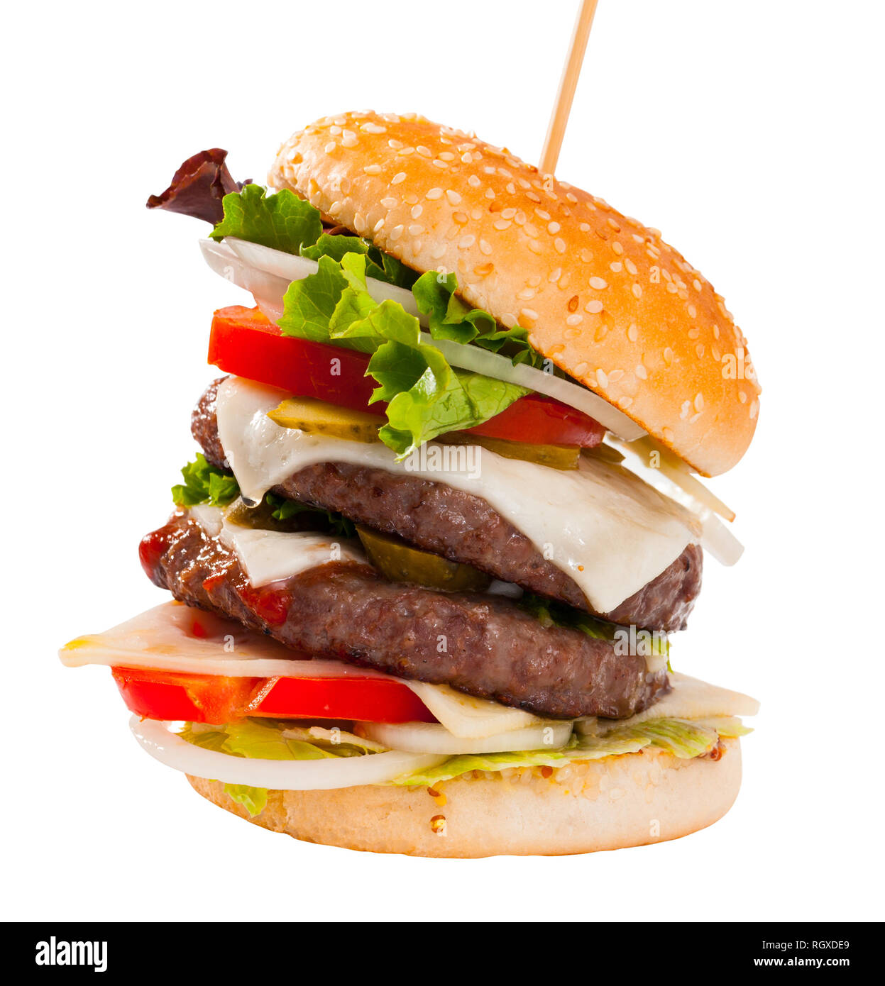 tasty grilled beef burger with cheese, lettuce, onion, cucumber, tomato ...
