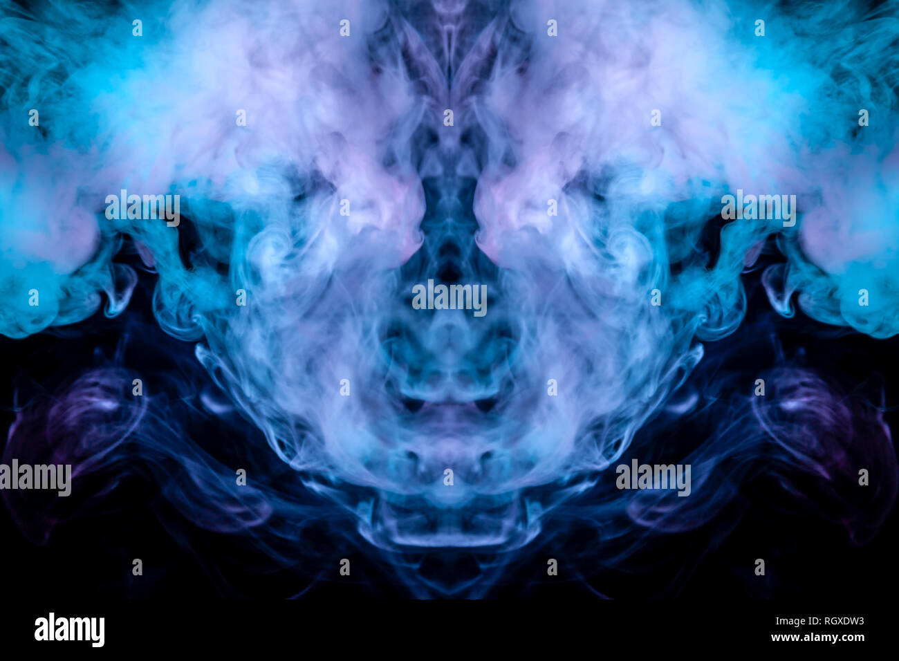 Abstract pattern of colored smoke backlit blue and turquoise takes the ...