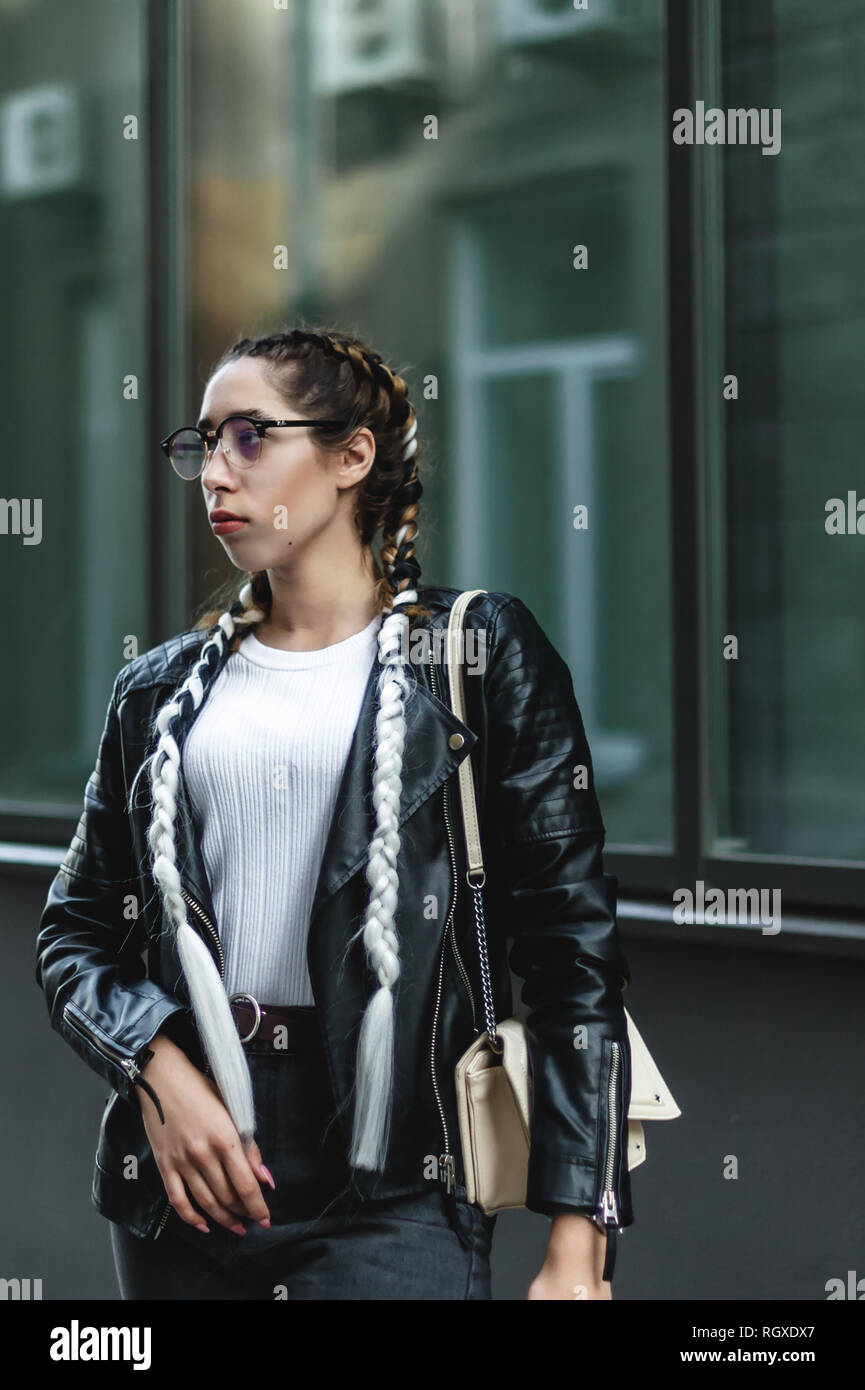 portrait of a young beautiful woman on street, model posing, women's ...