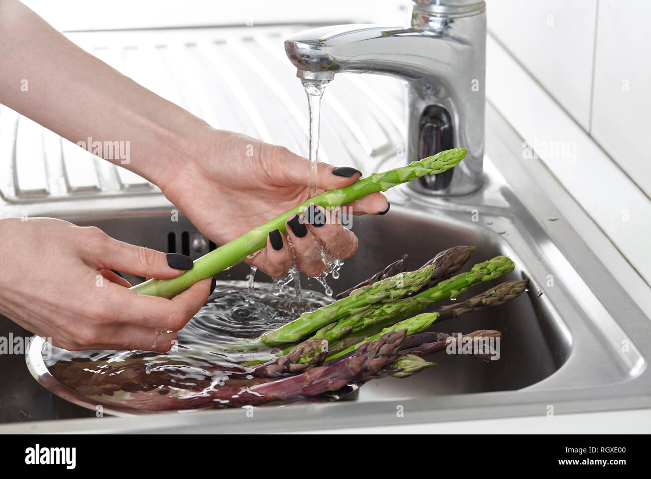Woman cooking pot cleaning hi-res stock photography and images - Alamy