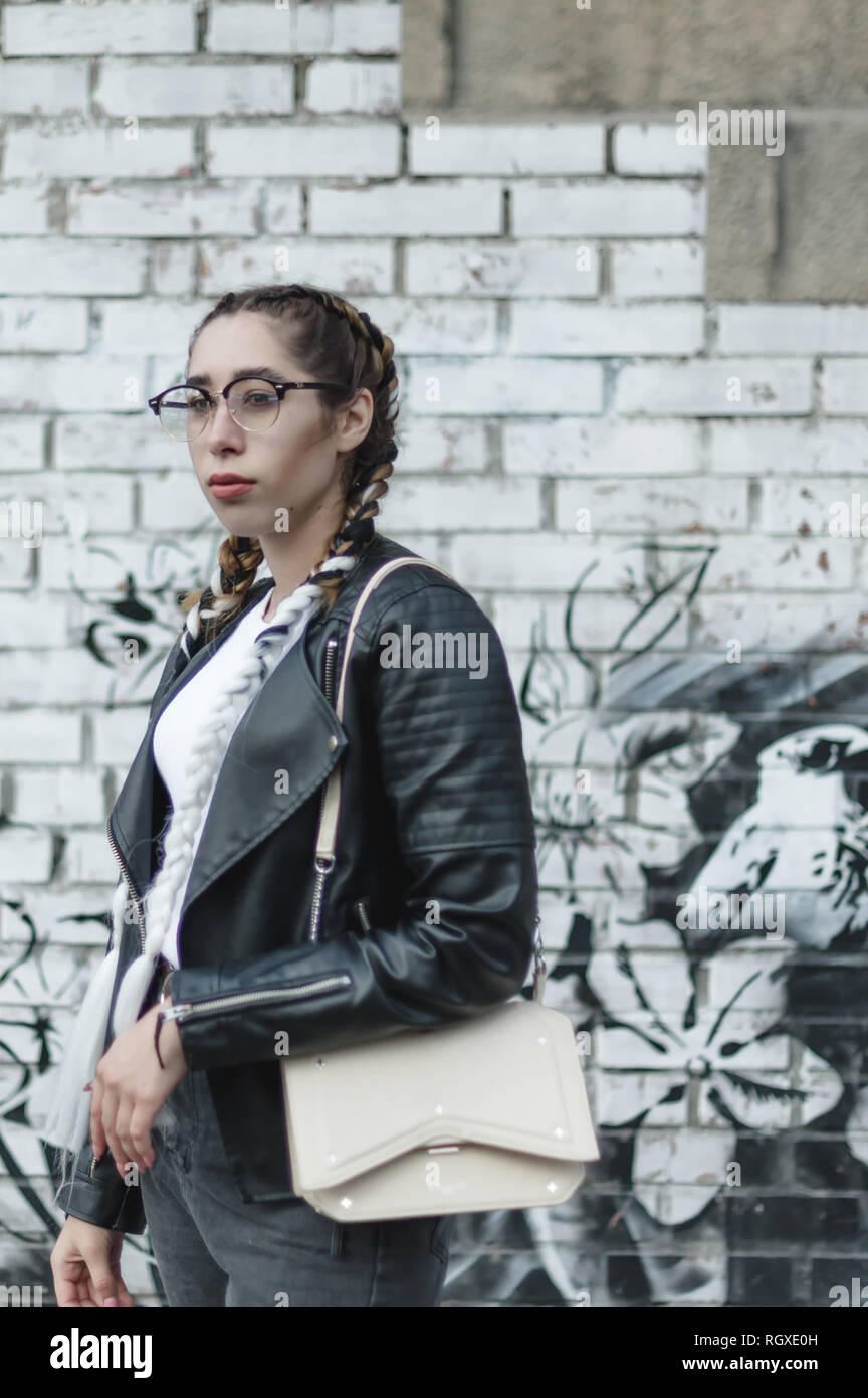 portrait of a young beautiful woman on street, model posing, women's ...