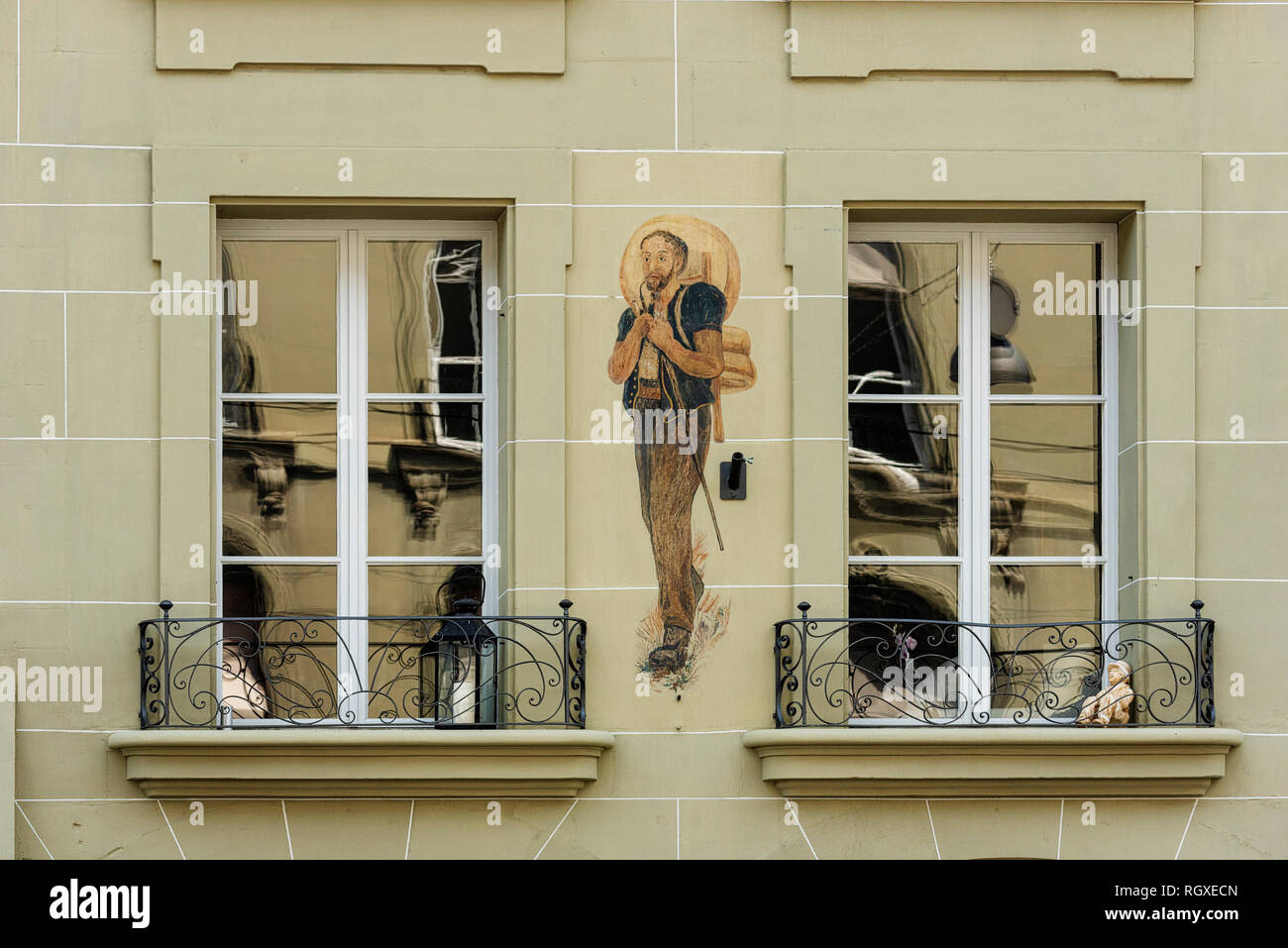 painting of a cheese maker on a wall of the old town in Bern ...