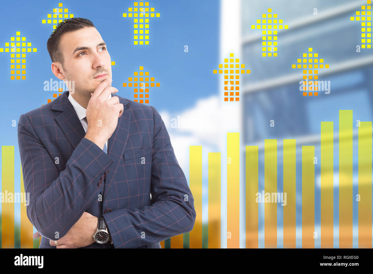 Serious focused male broker thinking as touching chin with hand on ...