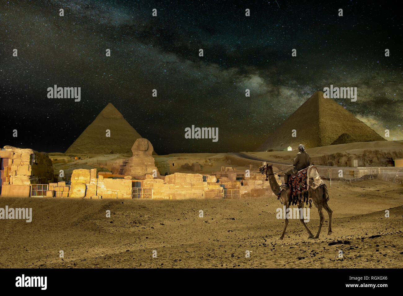 Giza pyramids and Sphinx light up at night Stock Photo - Alamy
