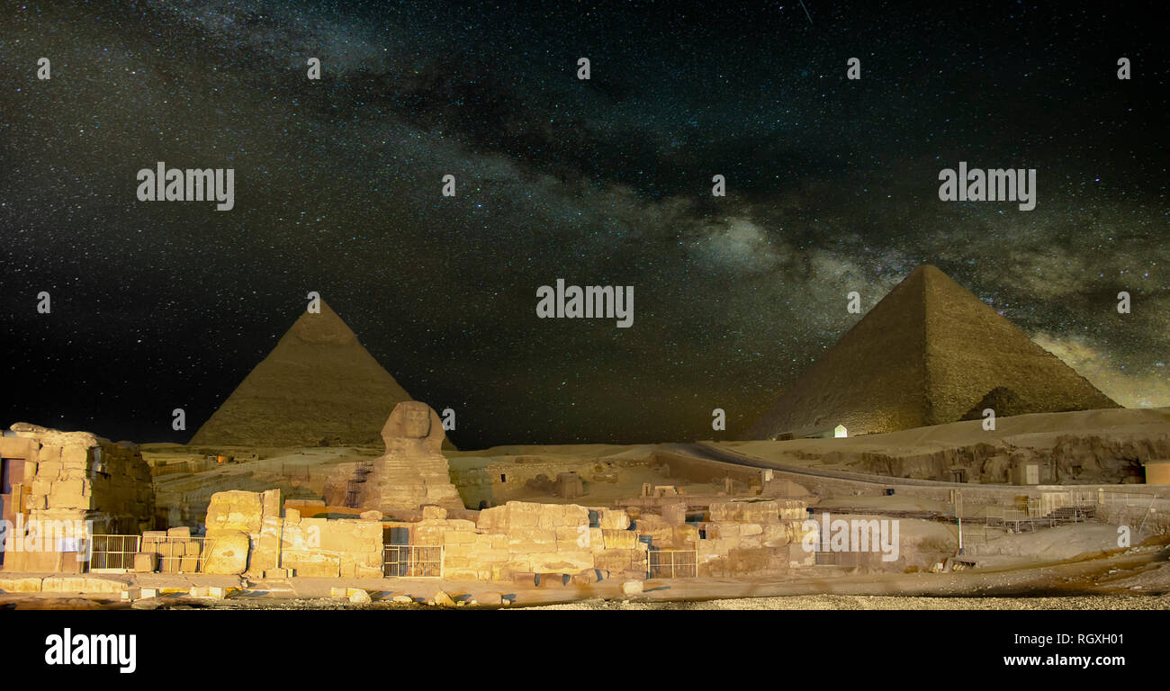 Giza pyramids and Sphinx light up at night Stock Photo - Alamy