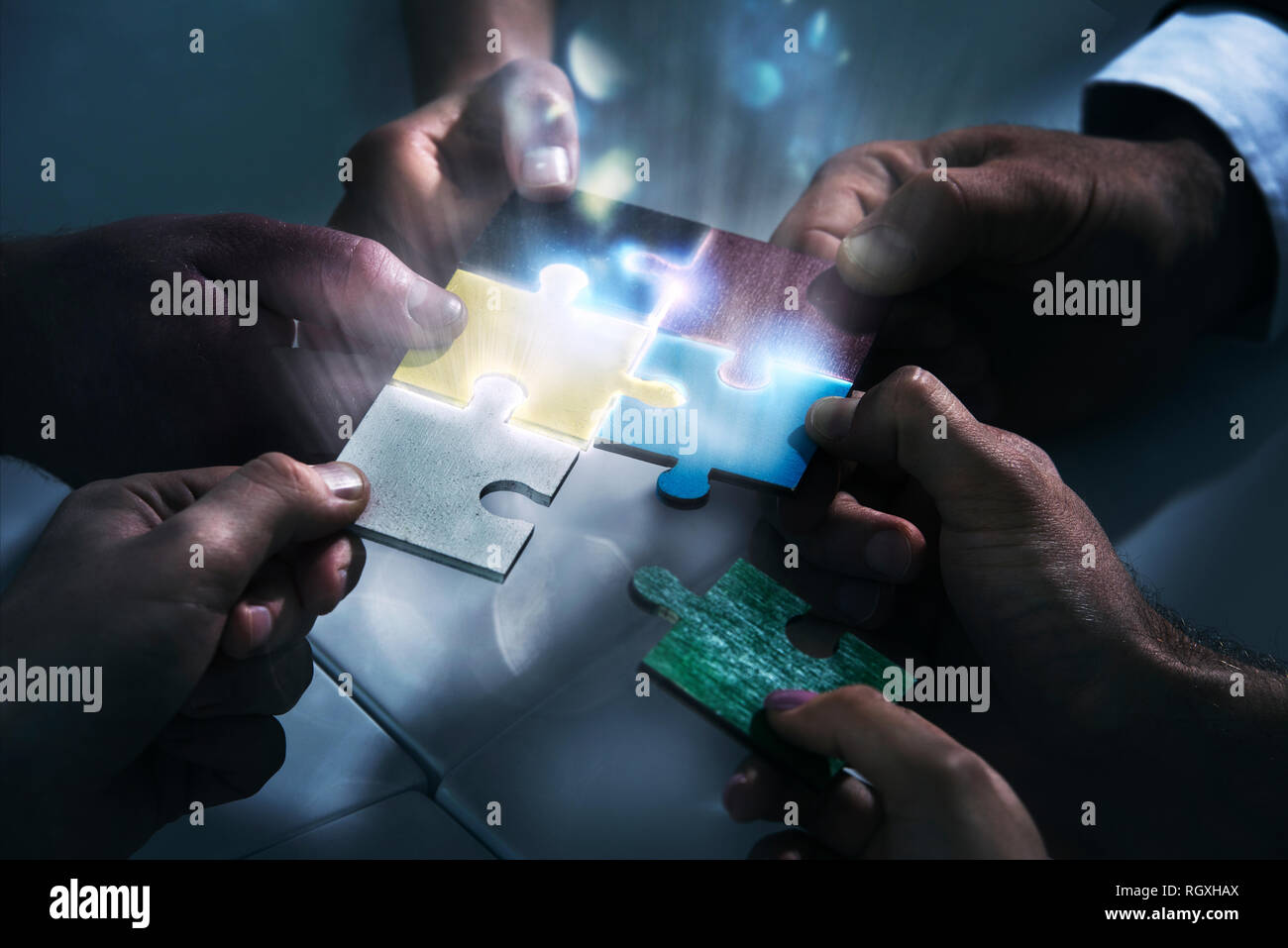 Businessmen working together to build a puzzle. Concept of teamwork ...