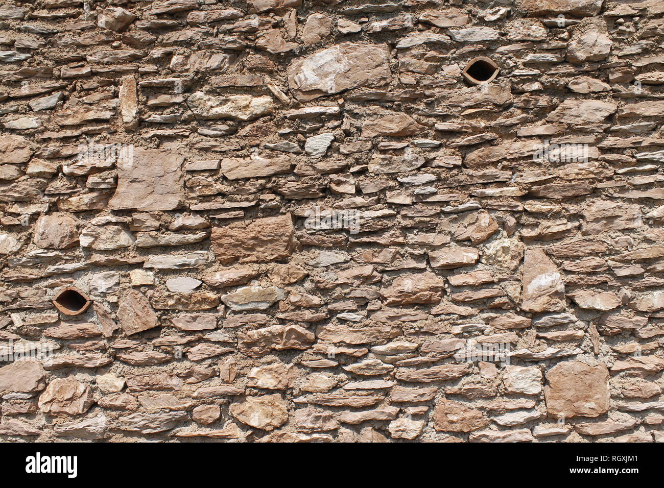 ancient wall with stone bricks. Old building material concept Stock ...