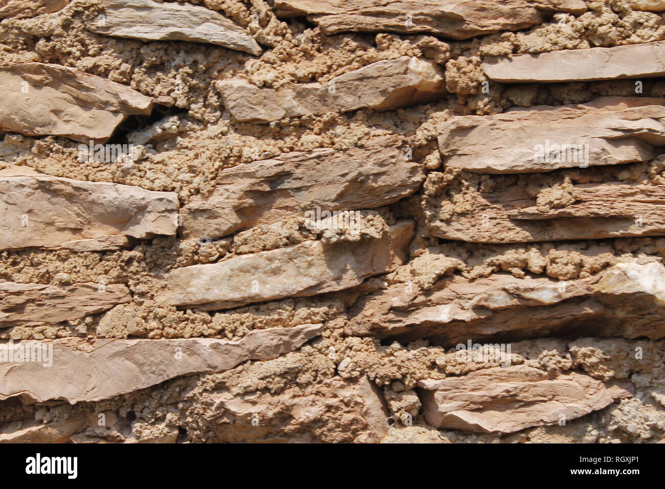 ancient wall with stone bricks. Old building material concept Stock ...