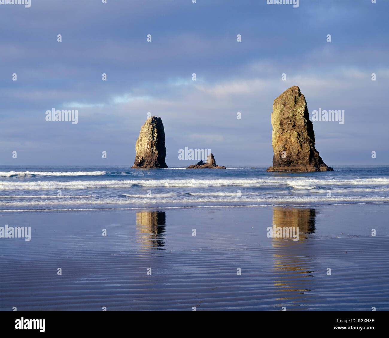 USA, Oregon, Cannon Beach, Early morning light on sea stacks called The ...