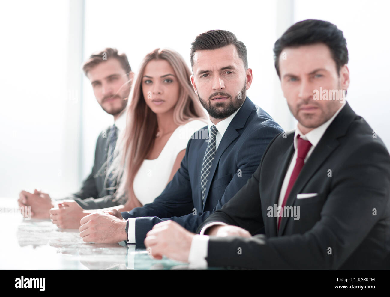 business group sitting at the negotiating table Stock Photo - Alamy