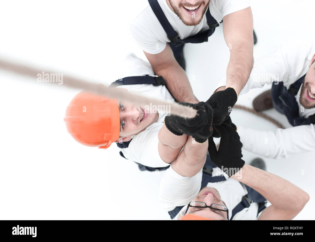 view from the top.a group of workers pulling a rope Stock Photo - Alamy