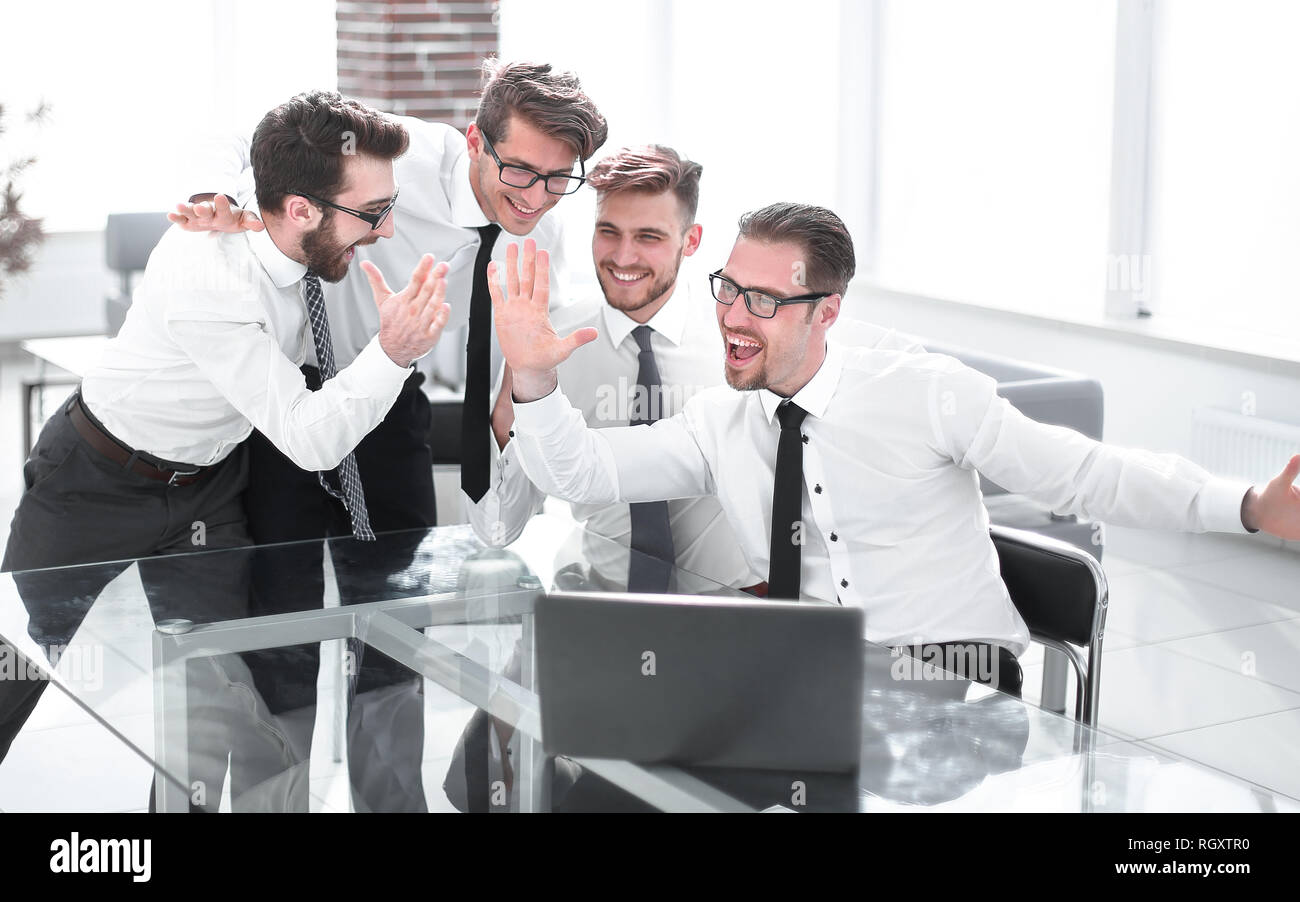 team of like-minded people giving each other a high five Stock Photo ...