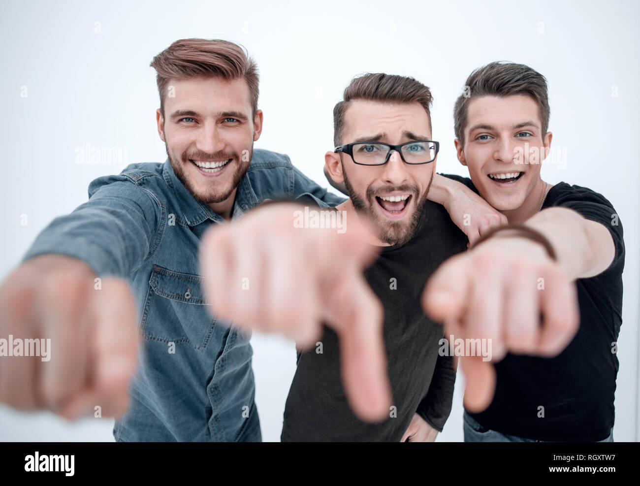 group of smiling male friends pointing at you Stock Photo - Alamy