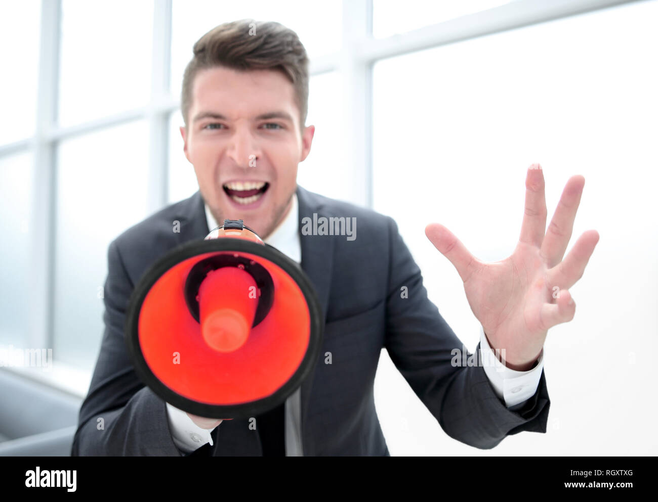 businessman screaming into a megaphone Stock Photo - Alamy