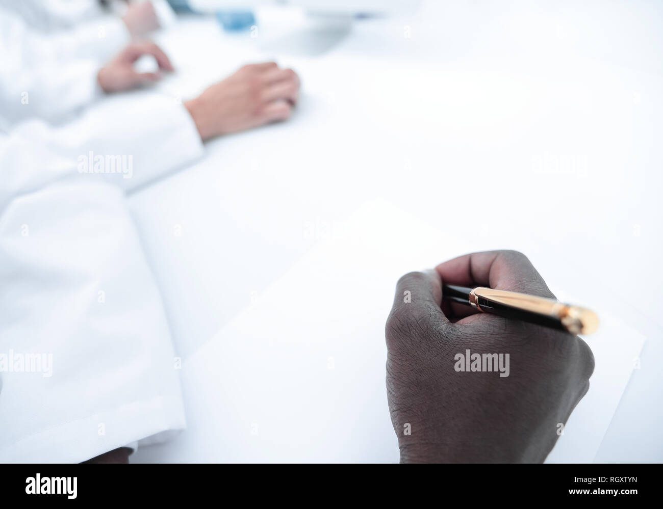 background image of a scientist recording data in a laboratory journal ...