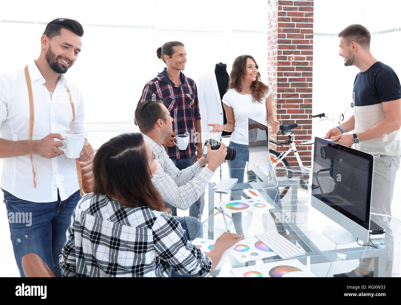 group of designers working in a modern office Stock Photo - Alamy