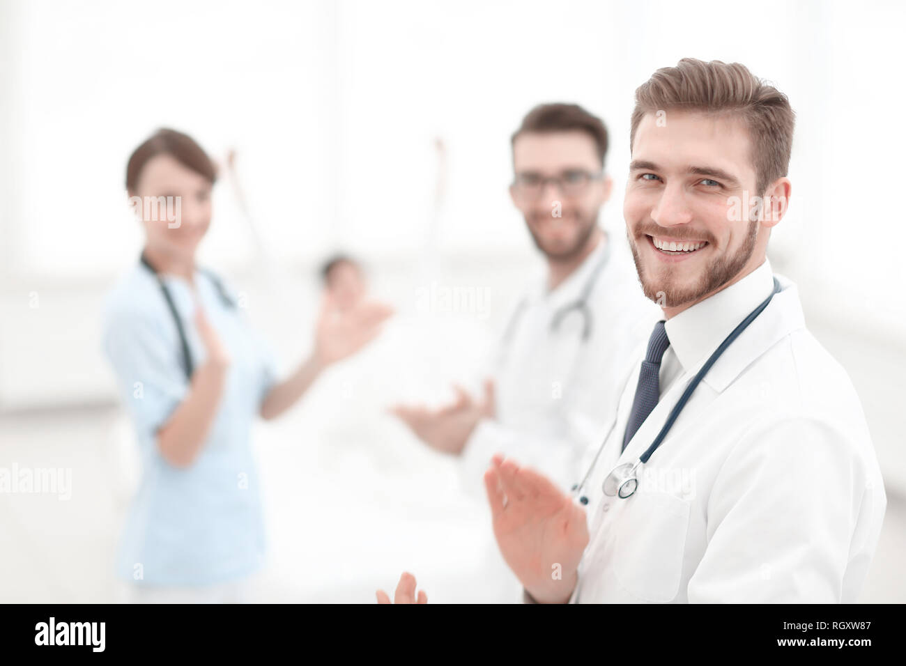 Doctors clapping hands and applauding on consent Stock Photo - Alamy