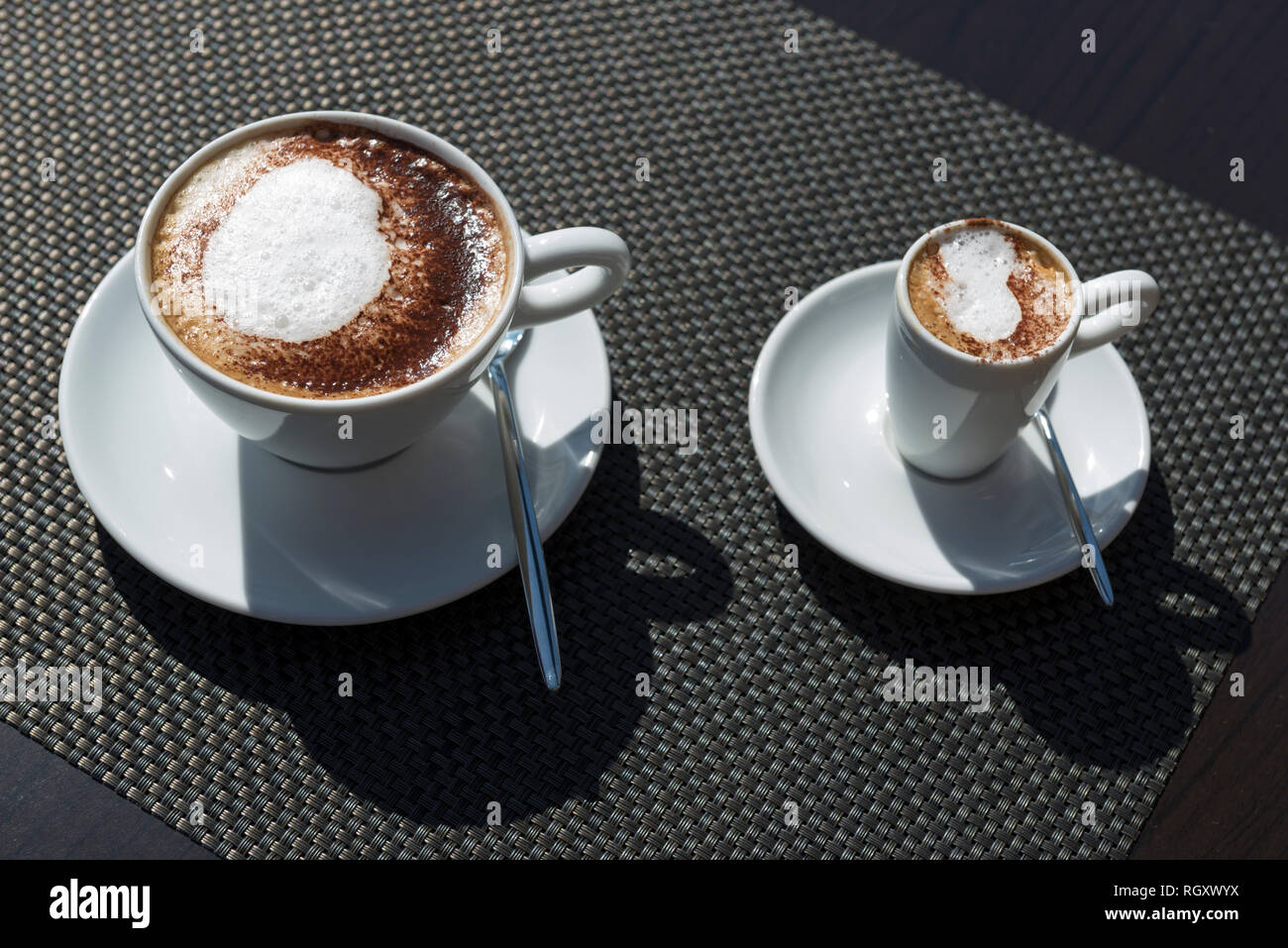 Big and small cups of coffee hi-res stock photography and images - Alamy