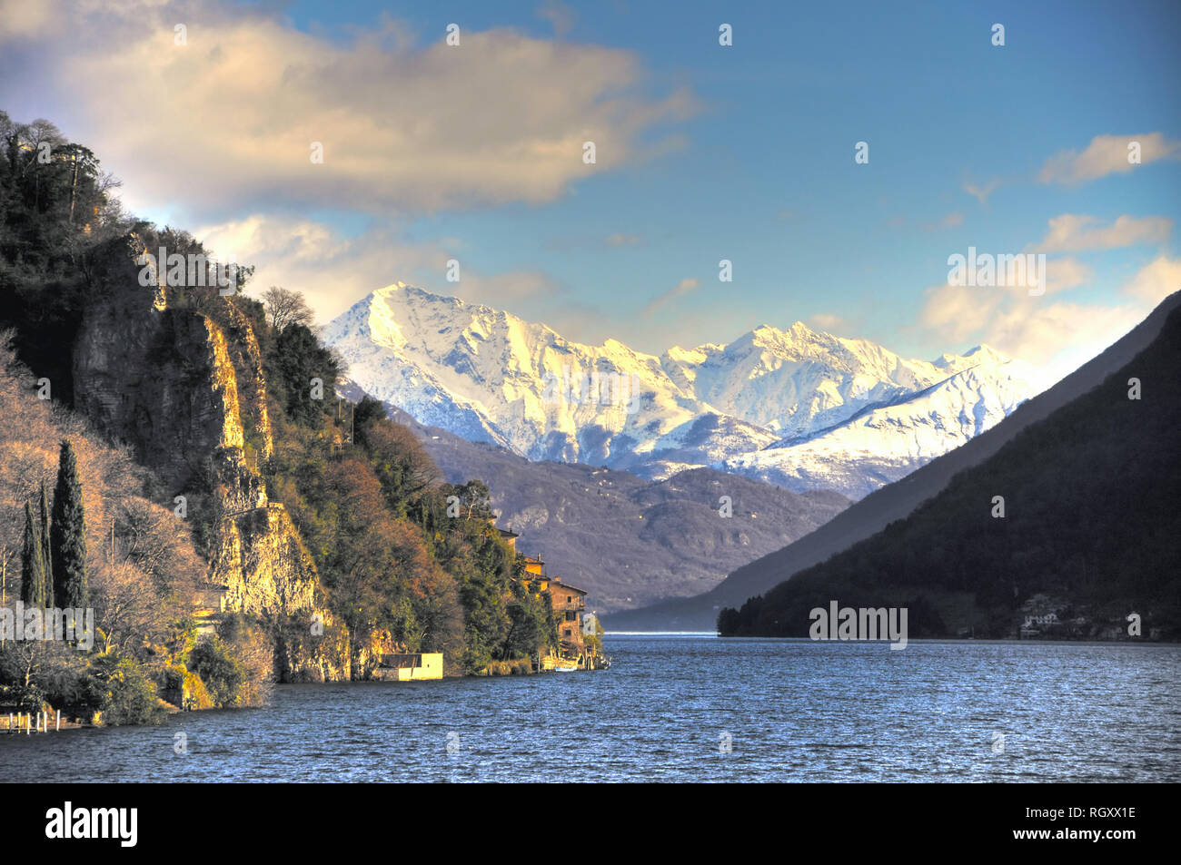 Alpine Lake Lugano with Snow-capped Mountain and Blue Sky and Clouds in ...