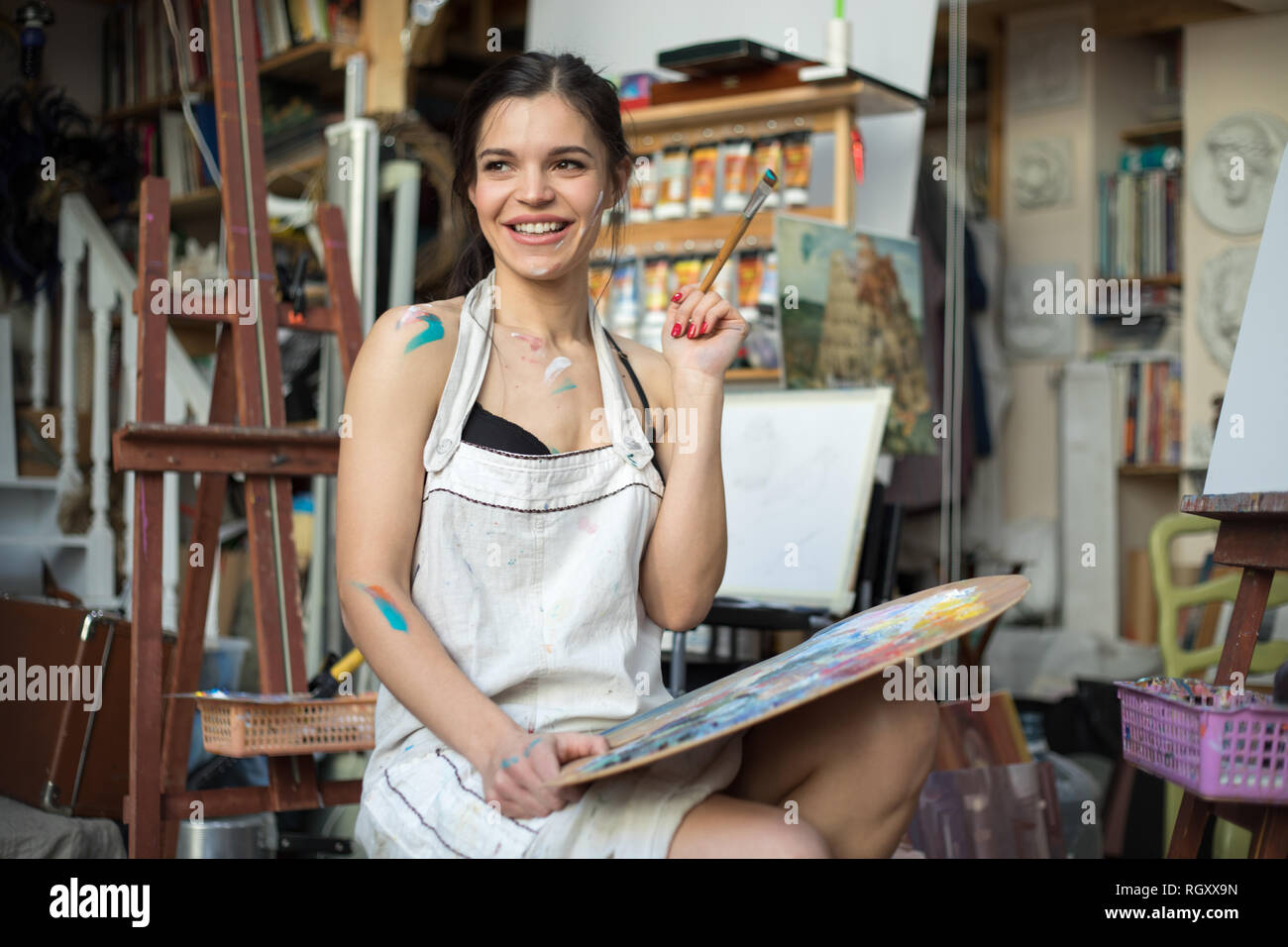 Woman artist painting picture in art studio. Female artist, drawing ...