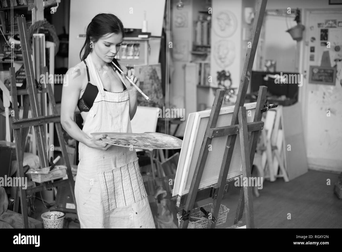 Woman artist painting picture in art studio. Female artist, drawing ...