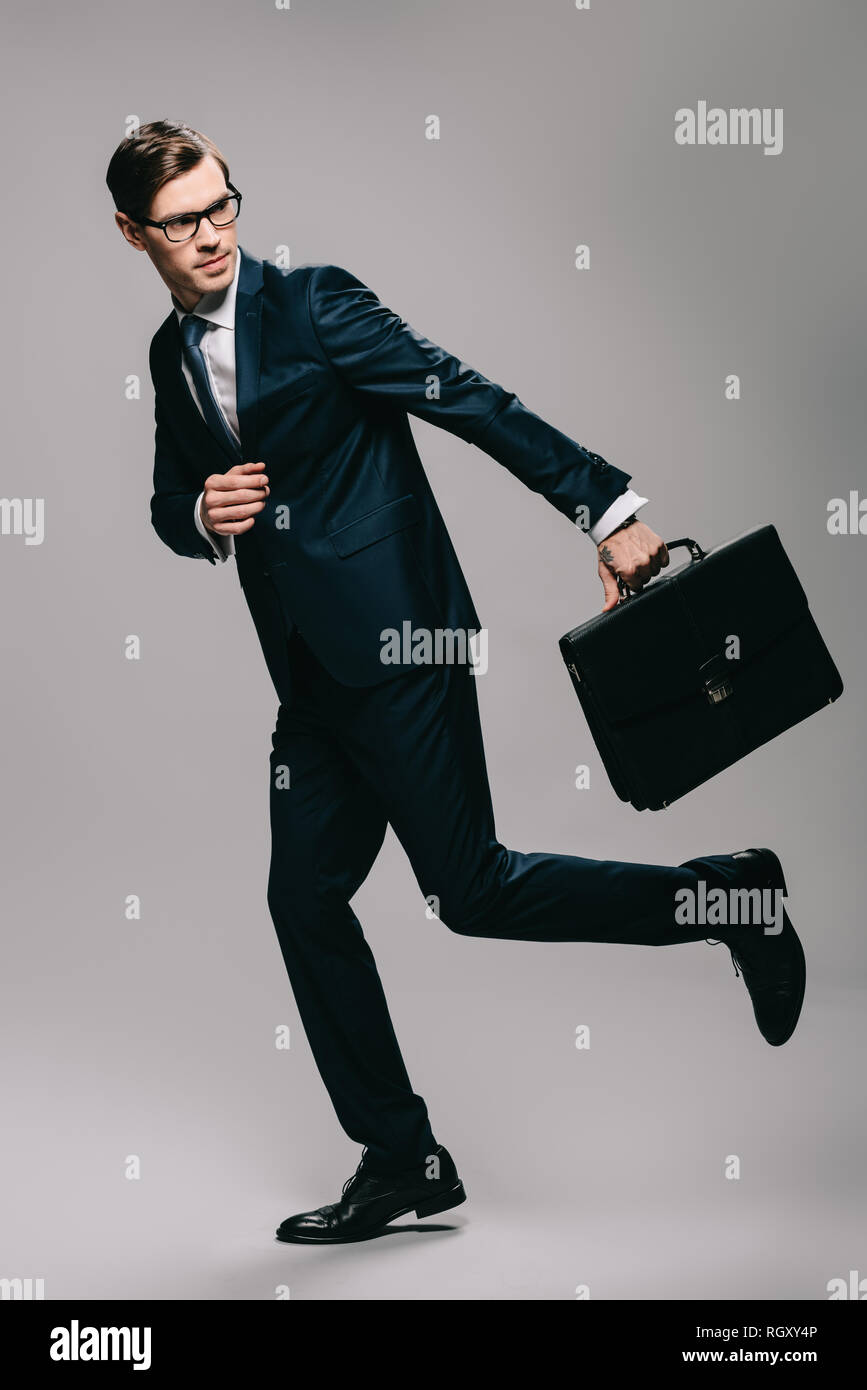 Man in suit briefcase running hi-res stock photography and images - Alamy
