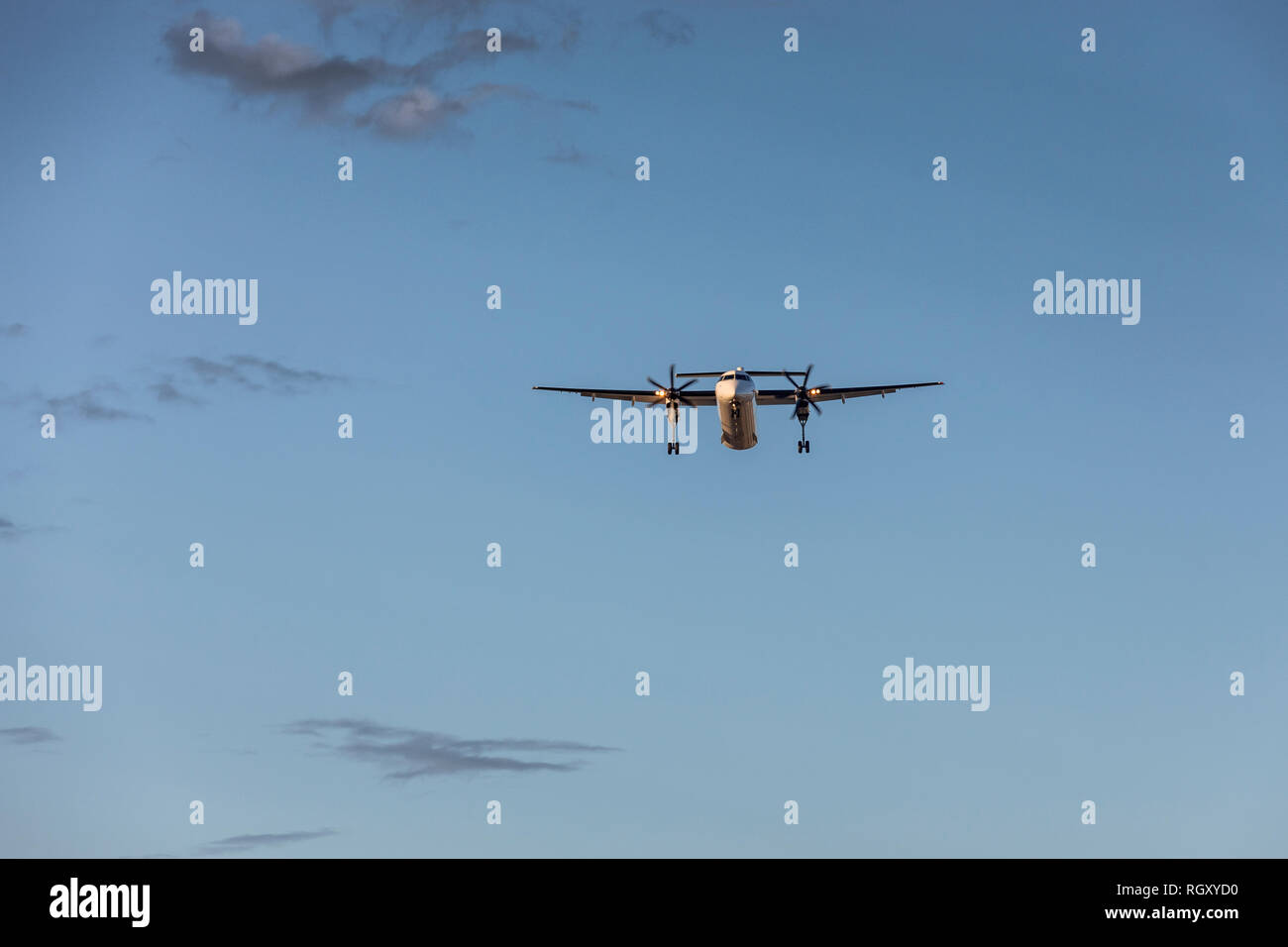 Flying aircraft preparing to land Stock Photo - Alamy