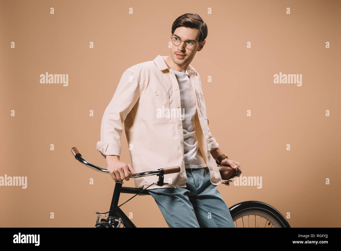 Handsome man on bike hi-res stock photography and images - Alamy