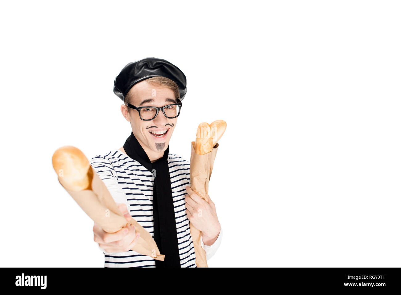 handsome french man in glasses smiling while holding baguettes isolated ...