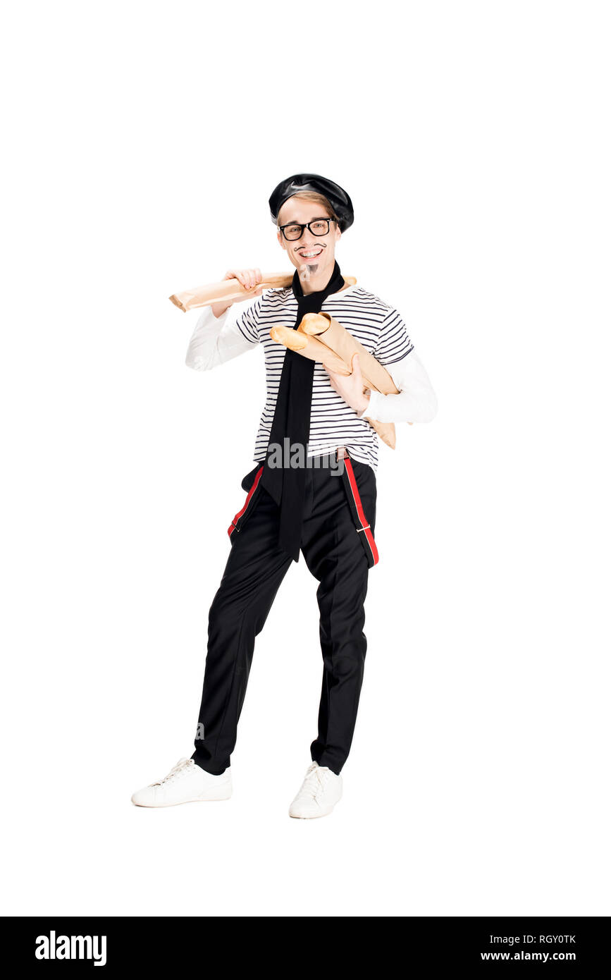 handsome french man smiling while holding baguettes isolated on white ...