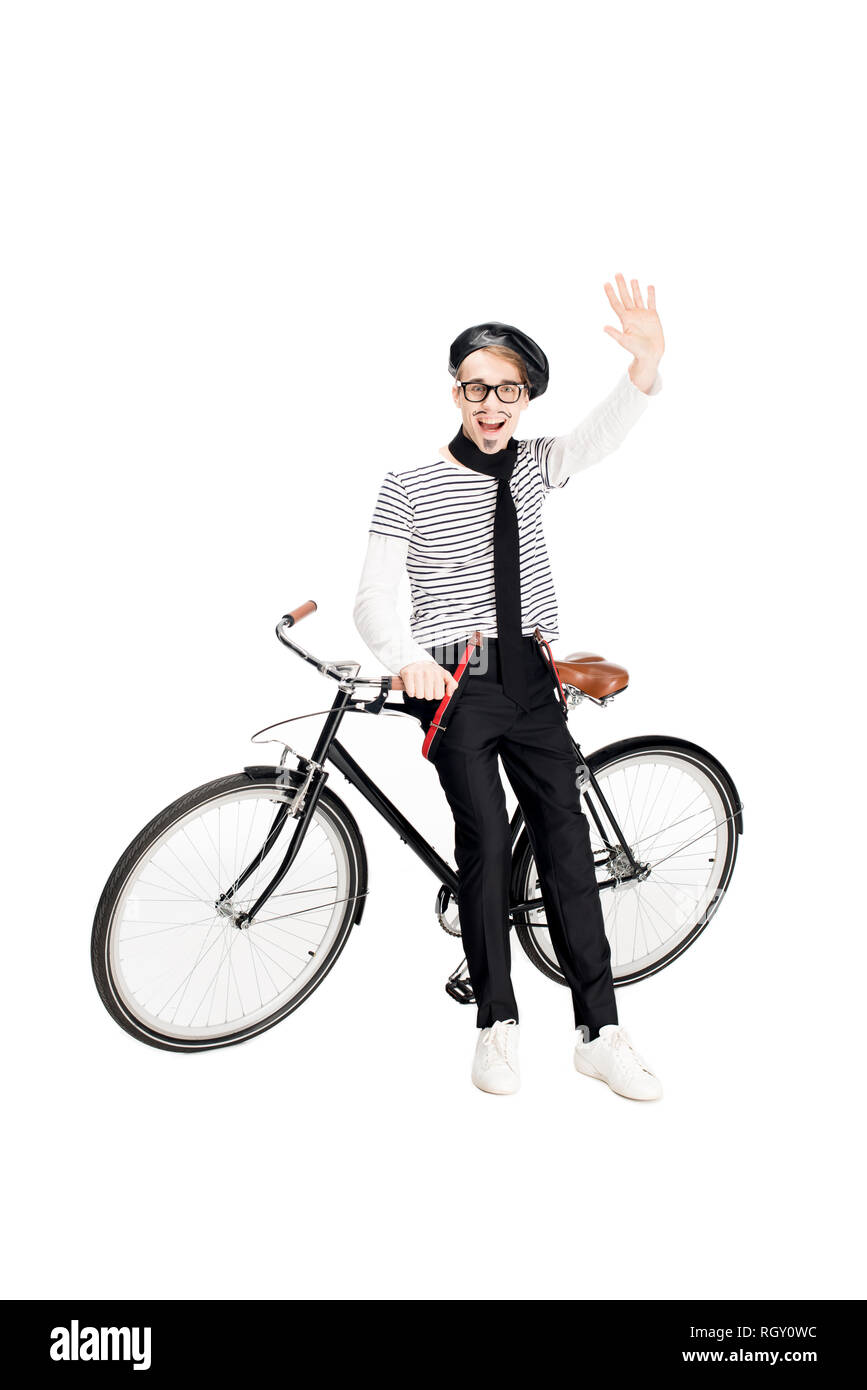 happy french man standing near bicycle and waving hand isolated on ...