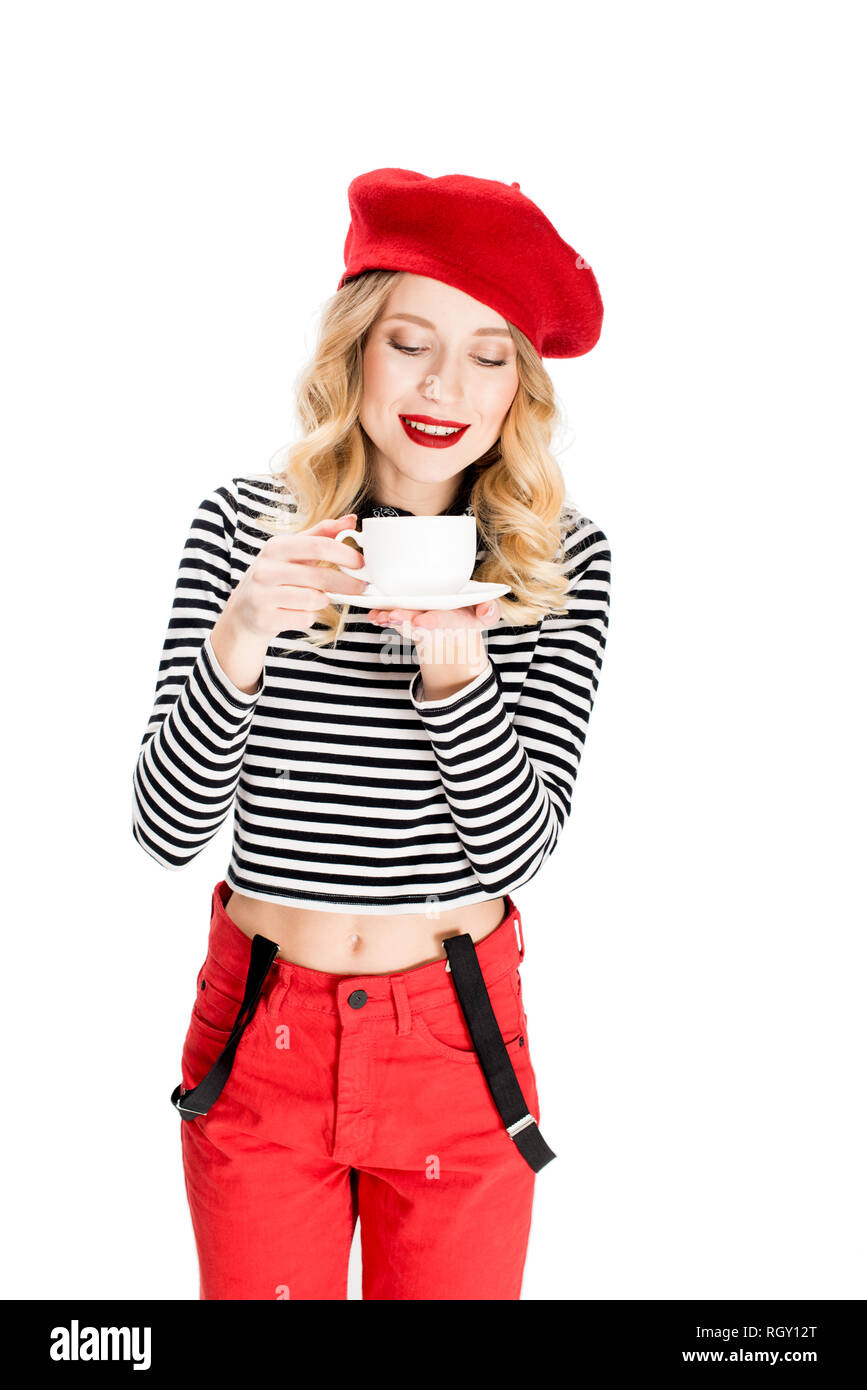 attractive woman in red beret holding cup of coffee in hands isolated ...