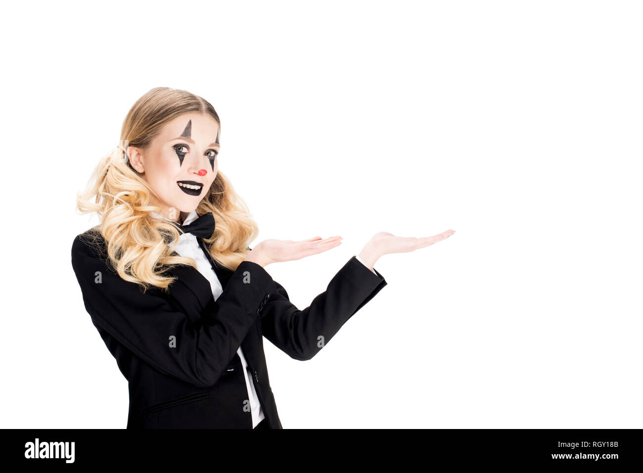 attractive blonde clown showing welcome gesture isolated on white Stock ...