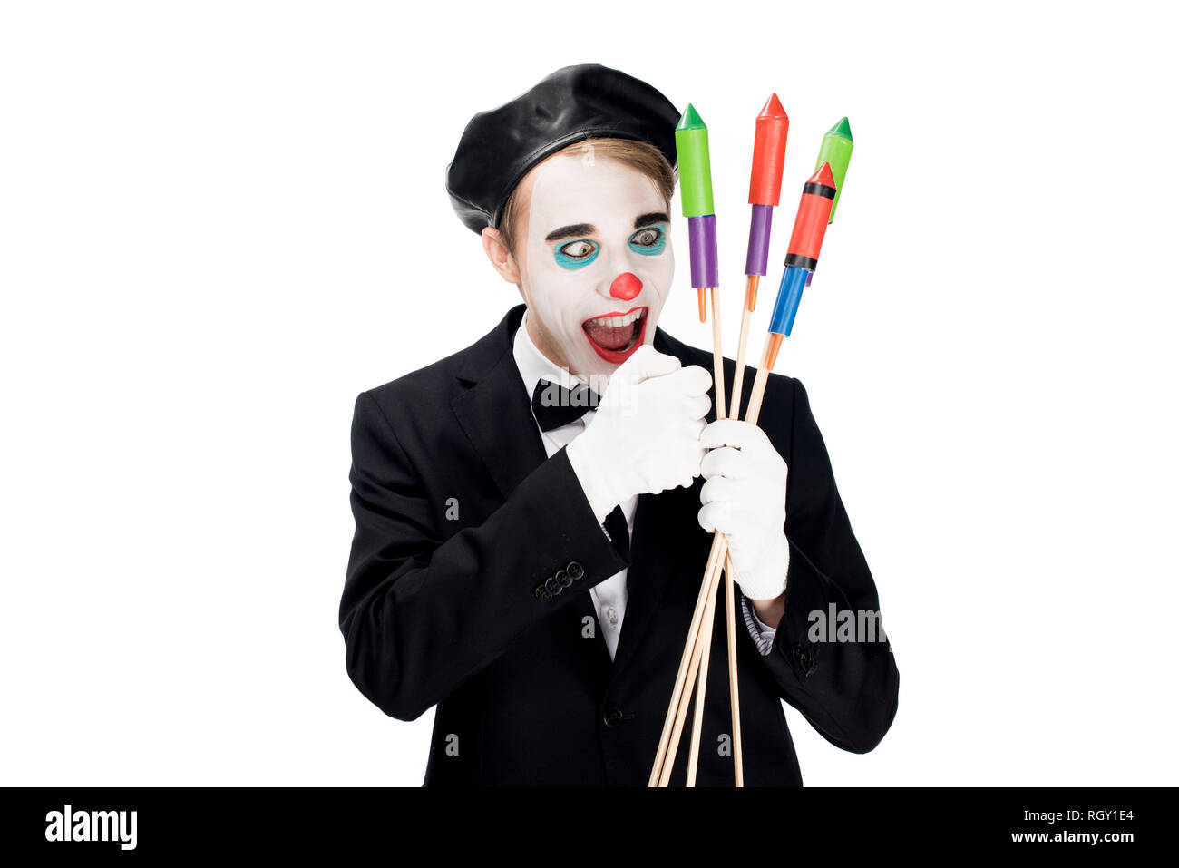crazy clown looking at firecrackers isolated on white Stock Photo - Alamy