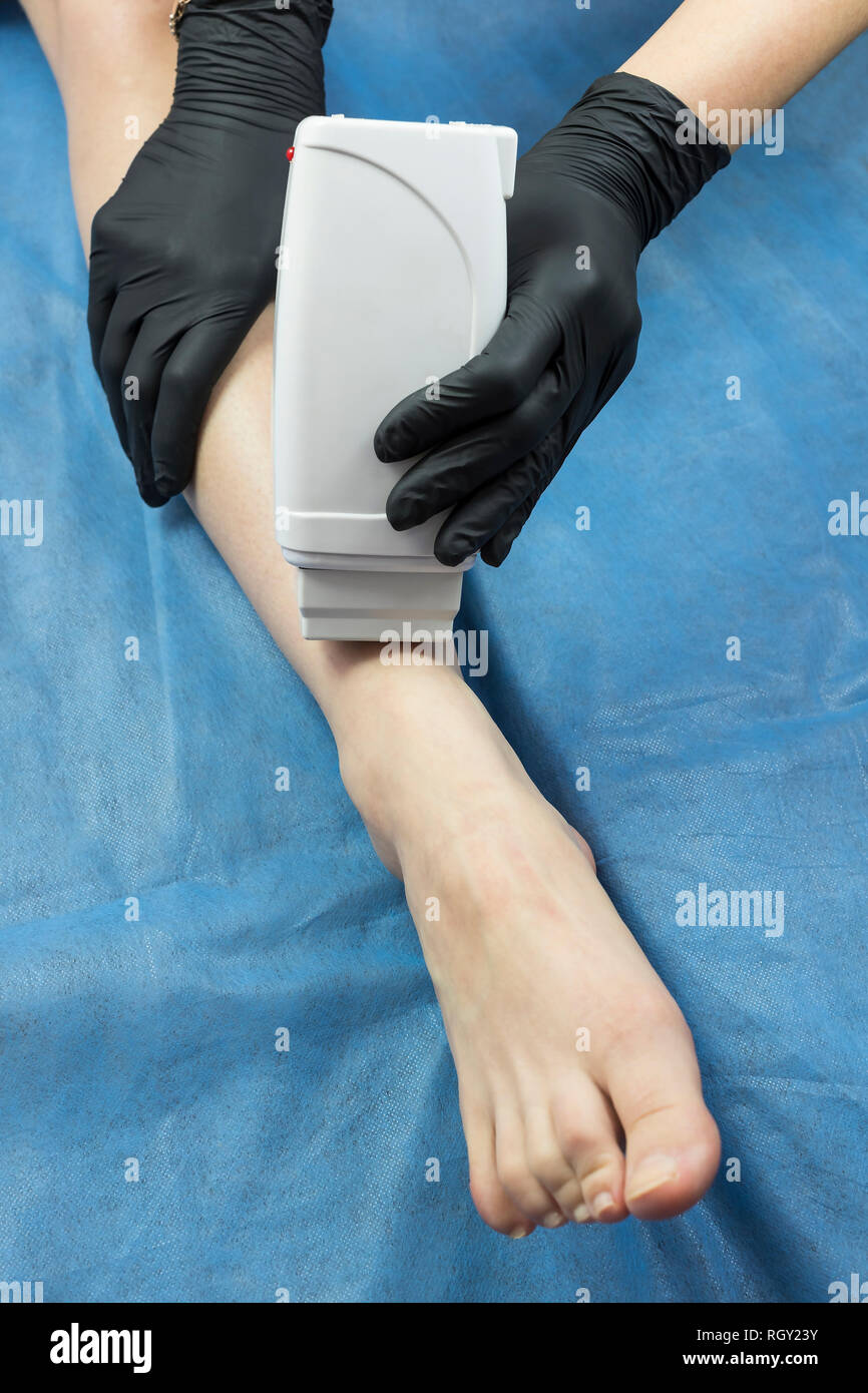 Process depilation female legs and hands in a beauty salon Stock Photo ...