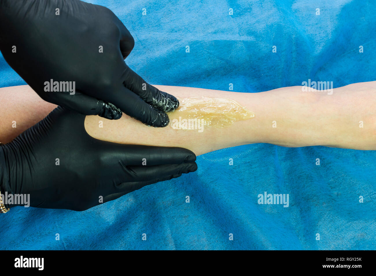 Process depilation female legs and hands in a beauty salon Stock Photo ...