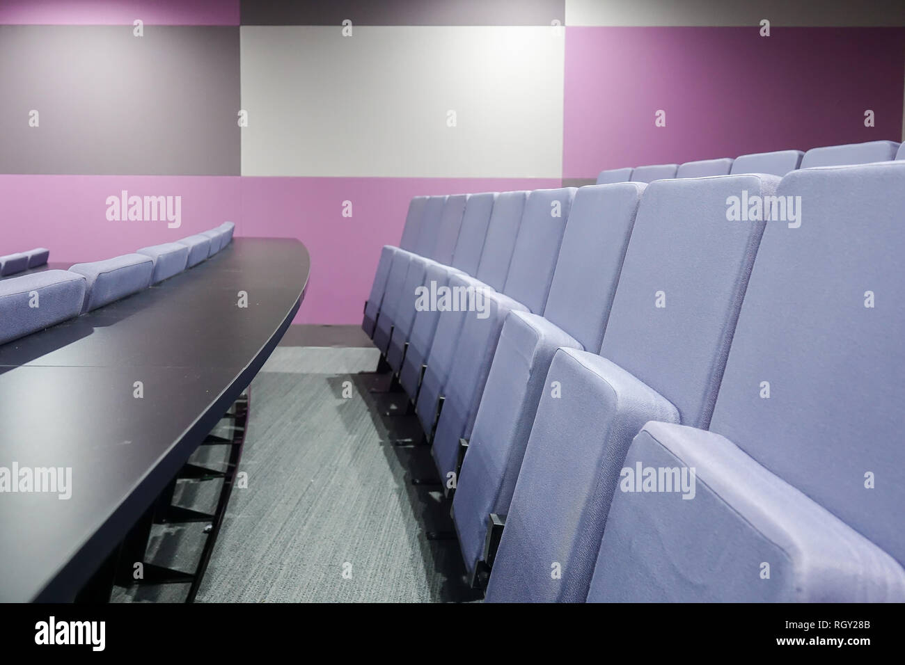 Lecture hall with grey chairs in university Stock Photo - Alamy