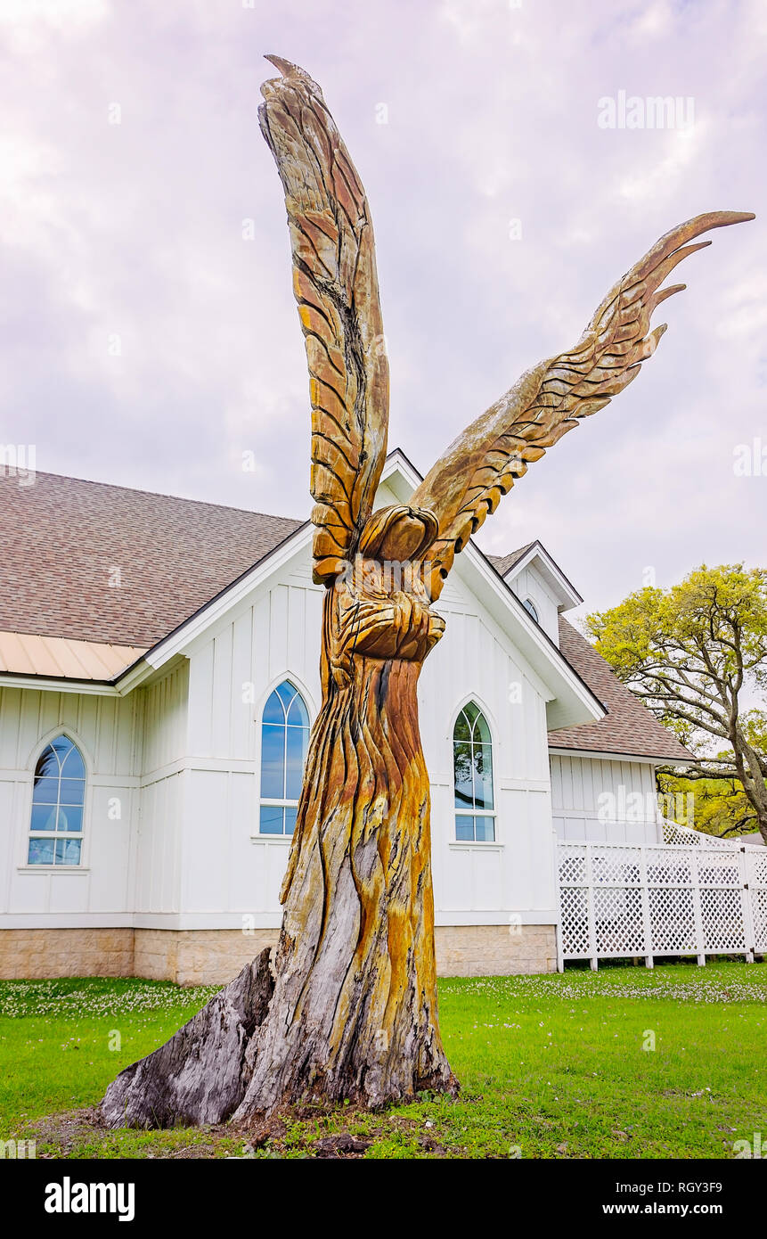 A wooden angel, carved from a tree damaged by Hurricane Katrina, stands ...