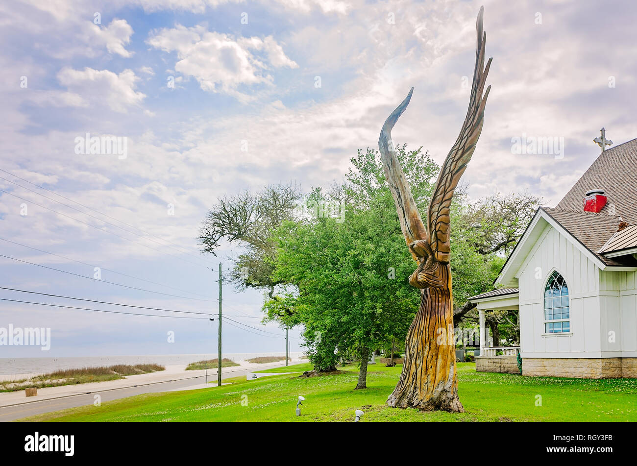 A wooden angel, carved from a tree damaged by Hurricane Katrina, stands ...