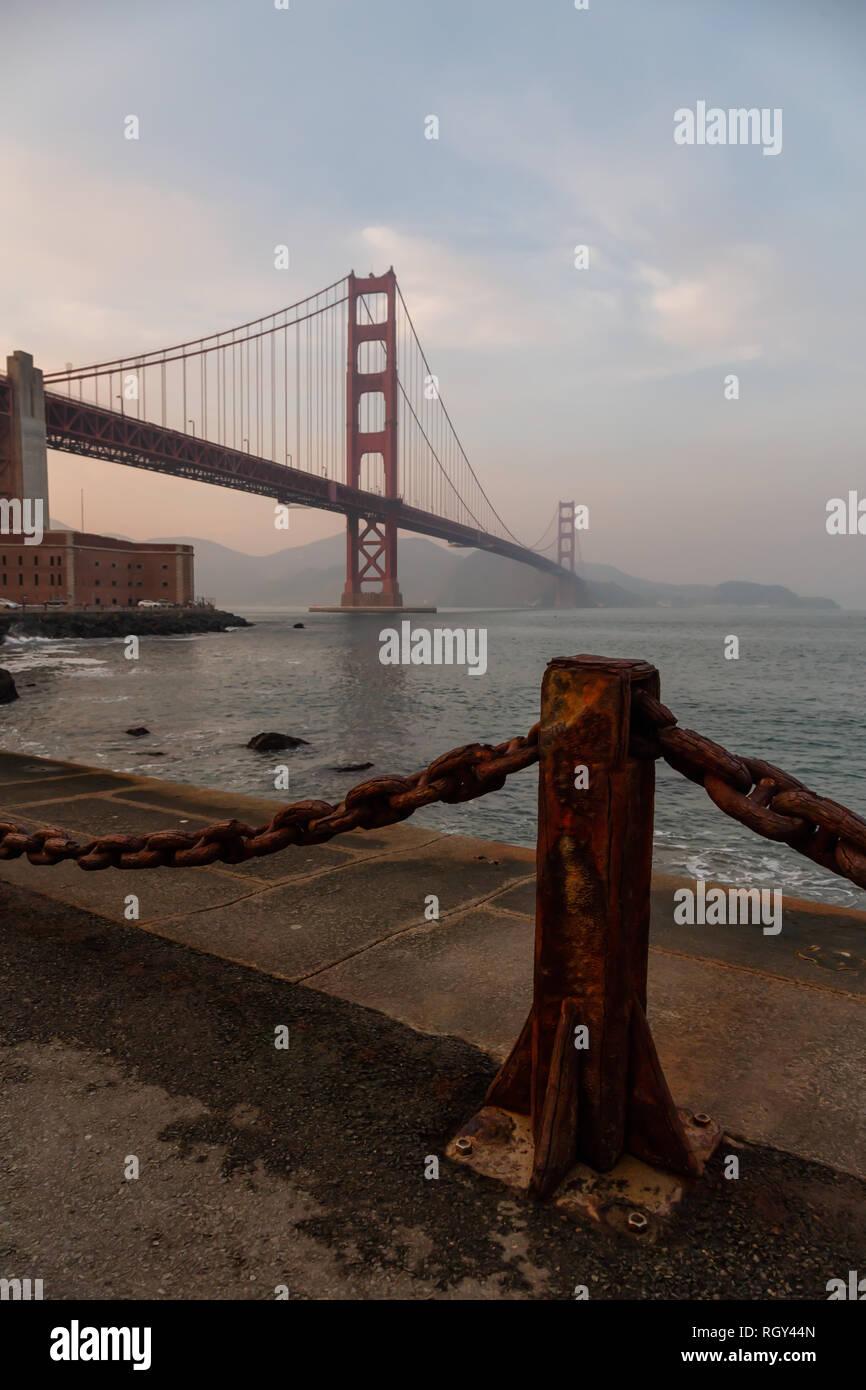Beautiful view of Golden Gate Bridge during a cloudy sunset. Taken in ...