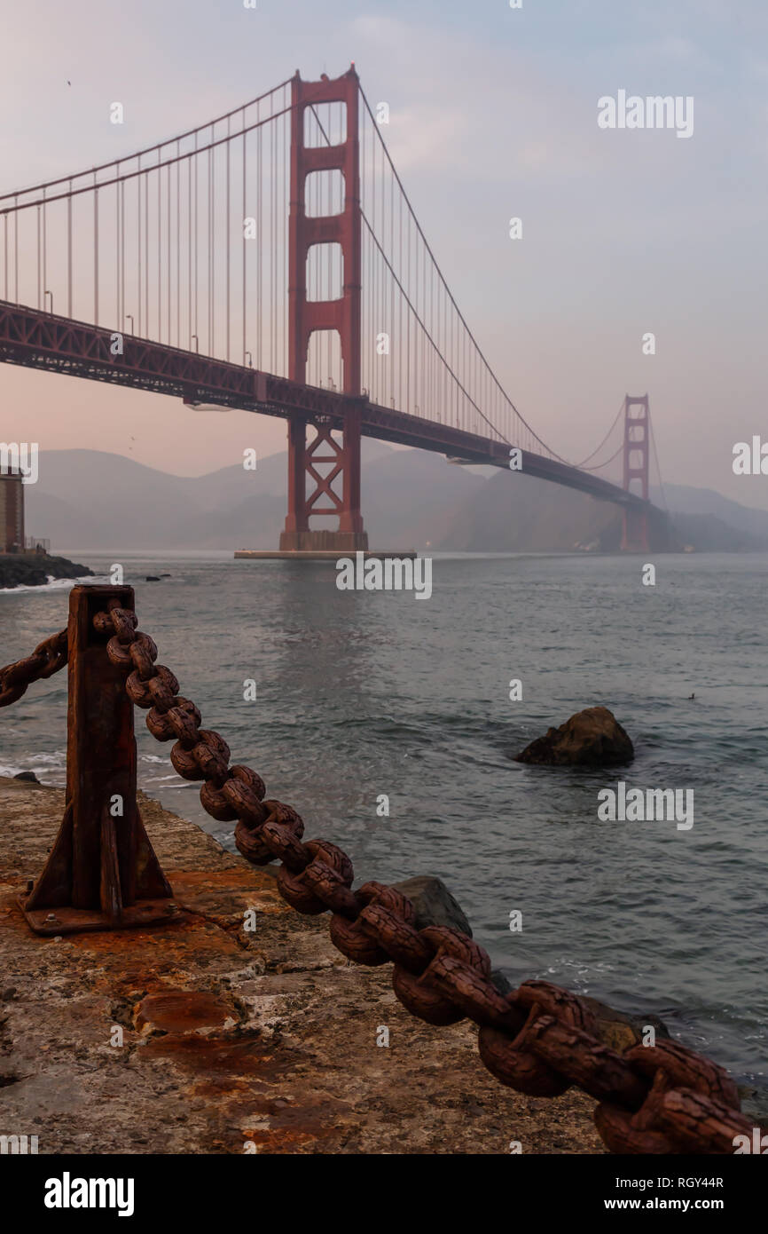 Beautiful view of Golden Gate Bridge during a cloudy sunset. Taken in ...