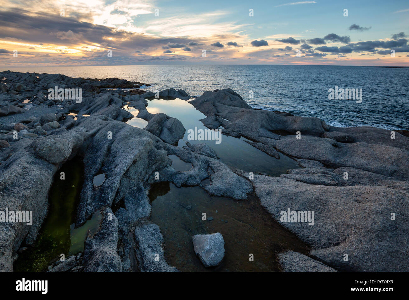 Beautiful rocky Atlantic Ocean Coast during a vibrant sunset. Taken at ...